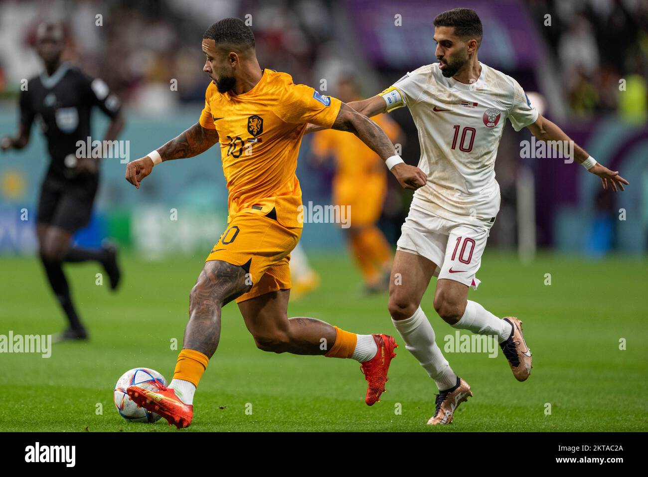 Memphis Depay of Netherlands and Hassan Alhaydos of Qatar during the ...