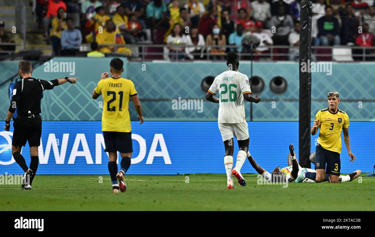 Doha, Qatar. 29th Nov, 2022. Referee Clement Turpin (1st L) gestures ...