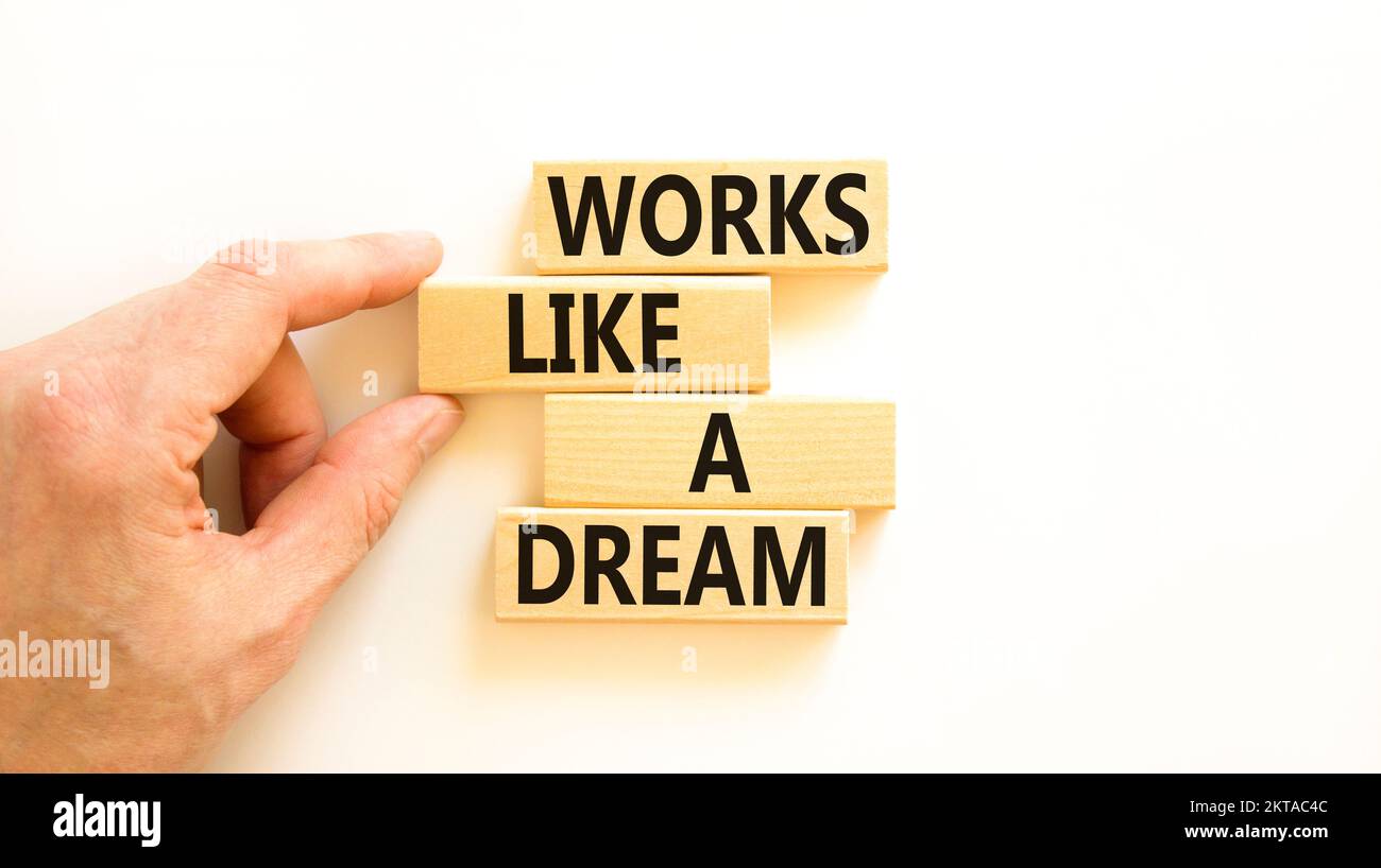 Works like a dream symbol. Concept words Works like a dream on wooden ...