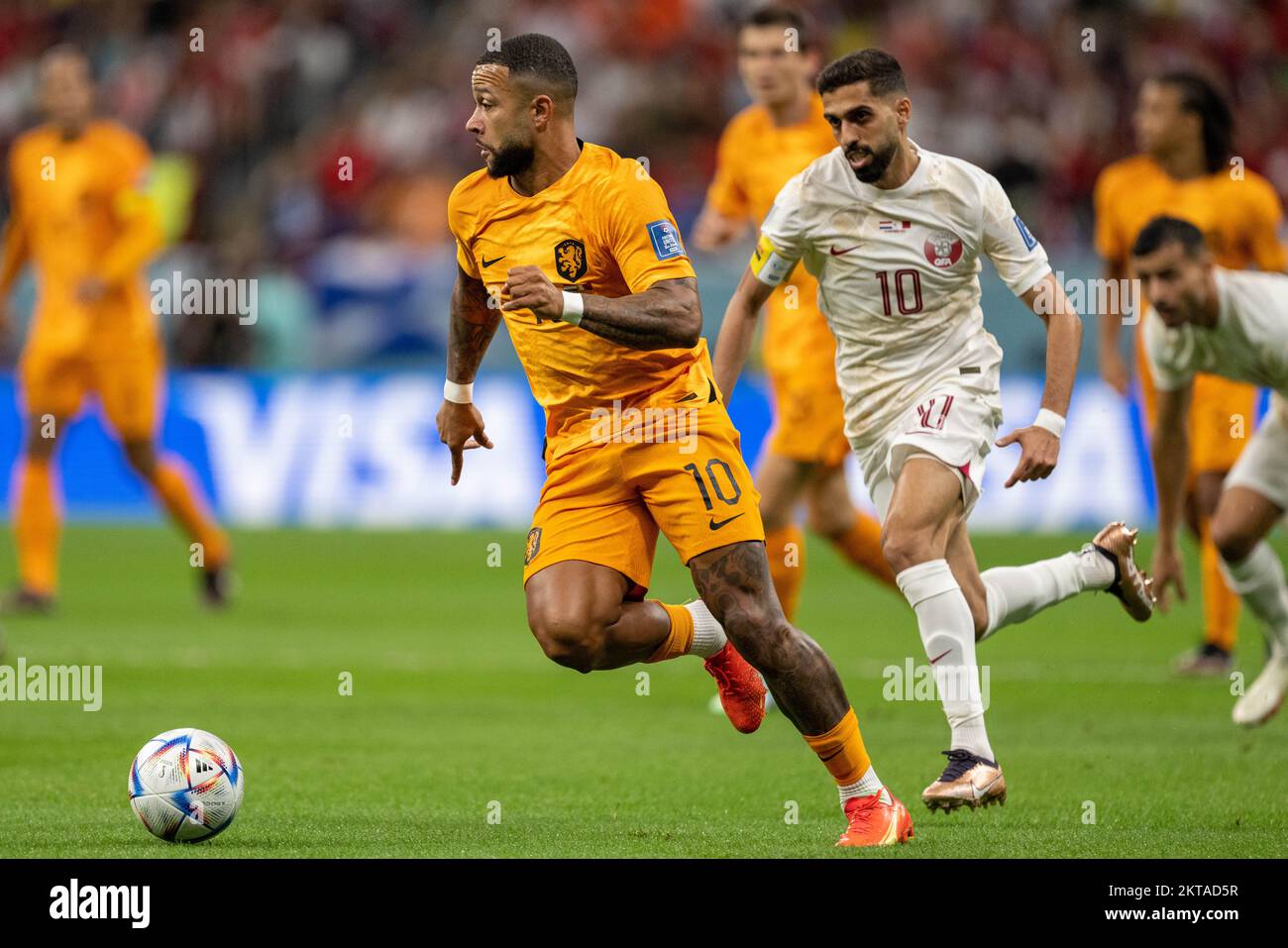Memphis Depay of Netherlands and Hassan Alhaydos of Qatar during the ...