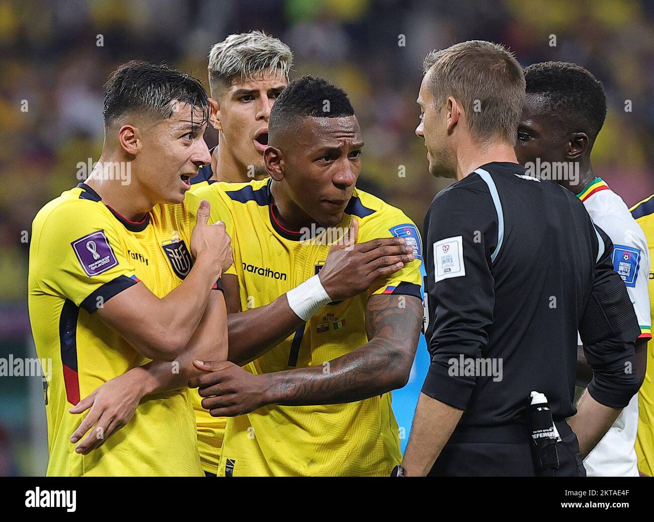 Doha, Qatar. 29th Nov, 2022. Referee Clement Turpin (2nd R ...
