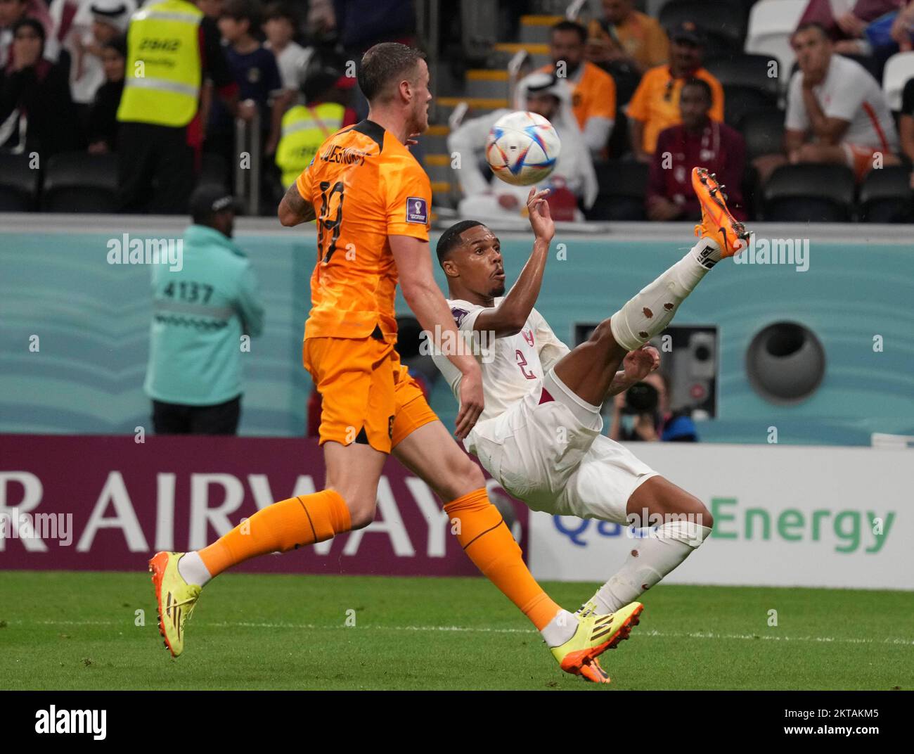 Al Khor, Qatar. 29th Nov, 2022. Pedro Miguel (R) of Qatar vies for the ...