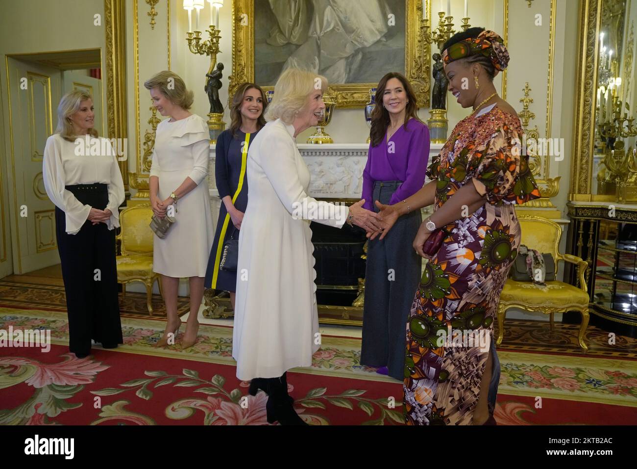 The Queen Consort shakes hands with the first lady of Sierra Leone ...