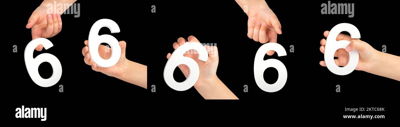 Number six in hand isolated on black background. Number 6 in a child's ...