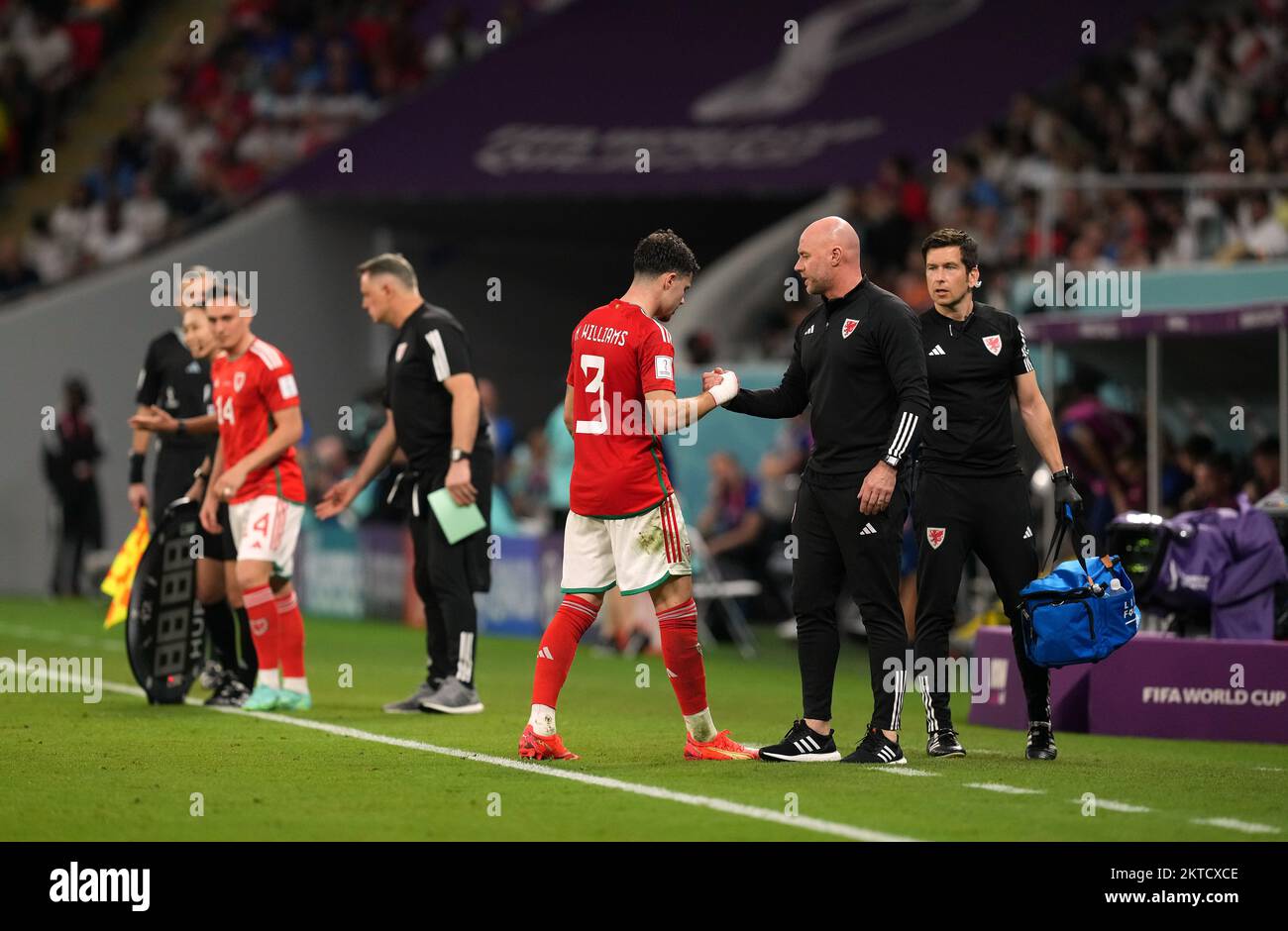 Wales’ Neco Williams leaves the pitch as a suspected concussion ...