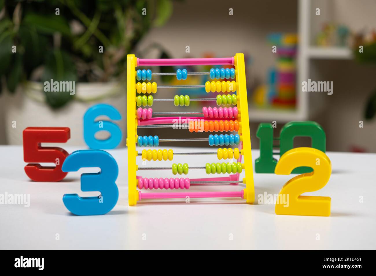 Colorful children's abacus on the table. Mathematics, arithmetic for ...