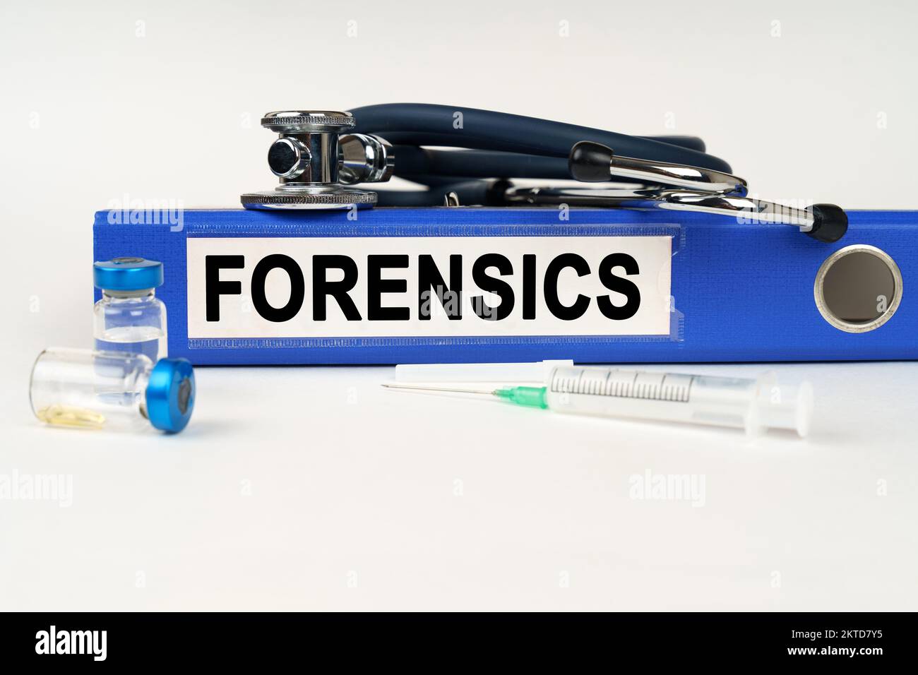 Medical concept. On a white surface, a syringe, a stethoscope and a ...