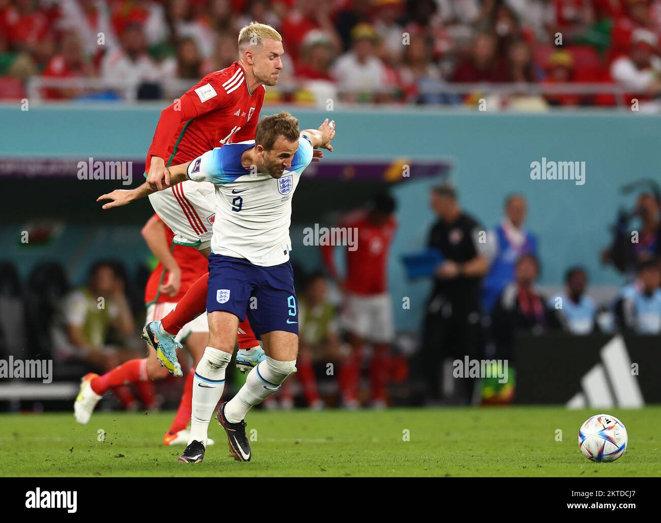 Al Rayyan, Qatar, 29th November 2022. Aaron Ramsey of Wales tussles ...