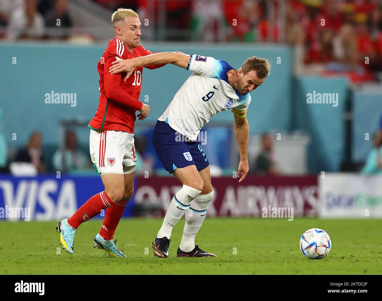 Al Rayyan, Qatar, 29th November 2022. Aaron Ramsey of Wales tussles ...