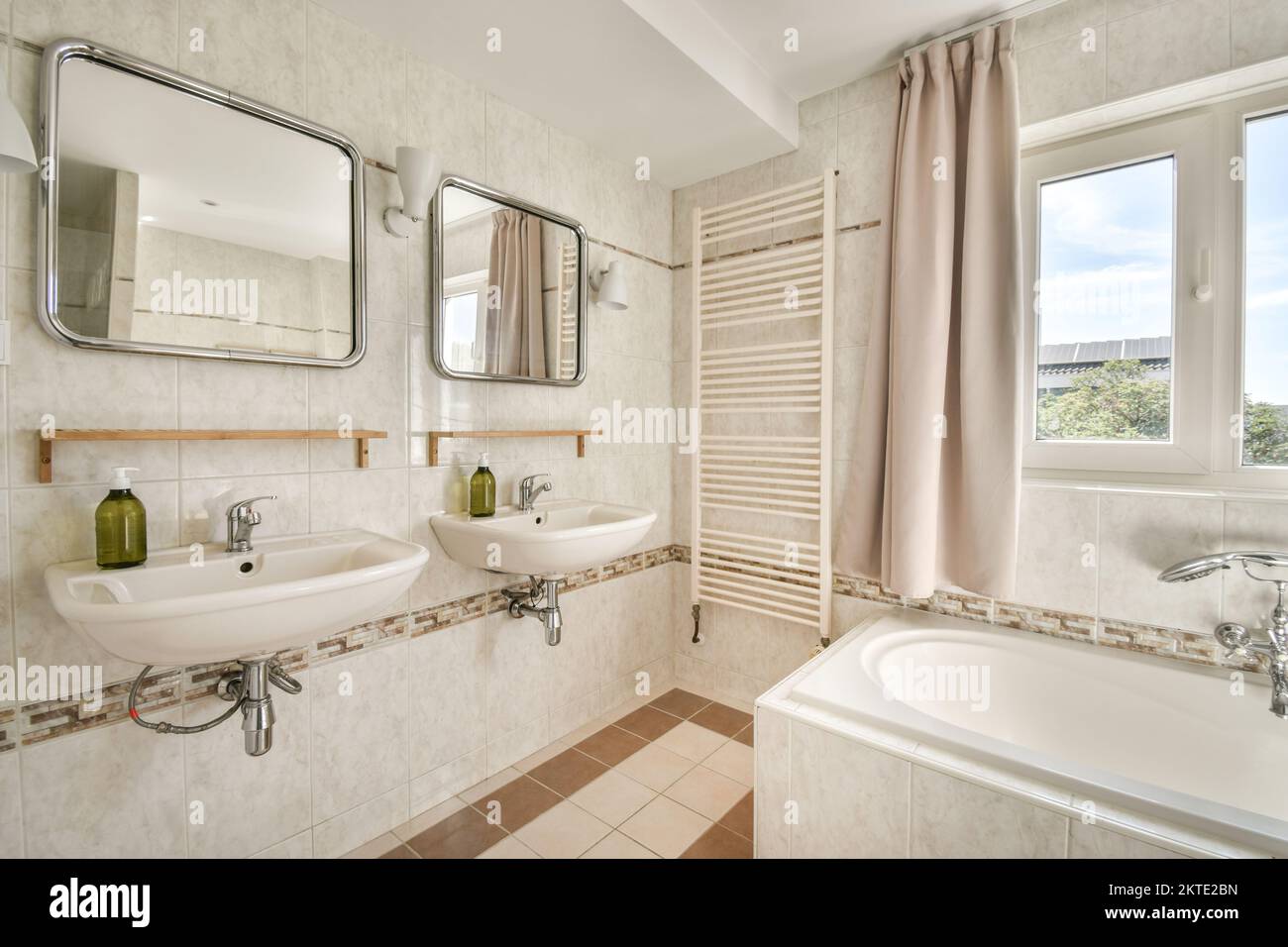 Contemporary bathroom with bathtub and glass shower cabin with light ...