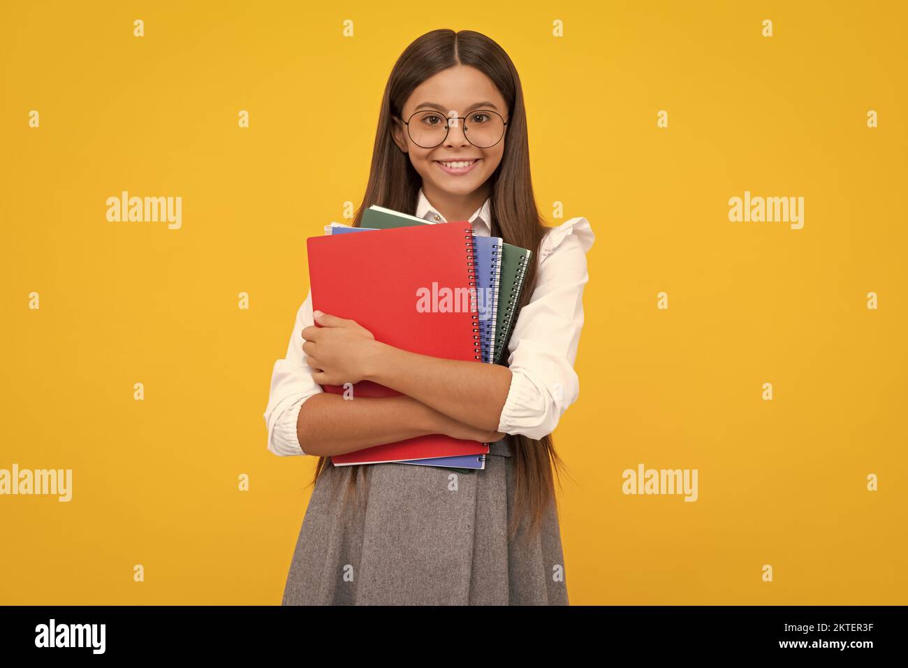 School child with book. Learning and education. Happy schoolgirl face ...