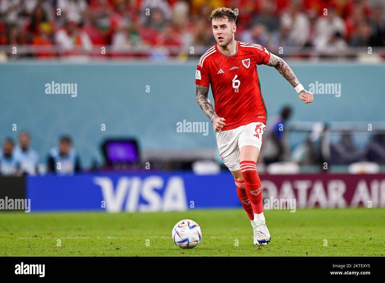 DOHA, QATAR - NOVEMBER 29: Joe Rodon of Wales runs with the ball during ...