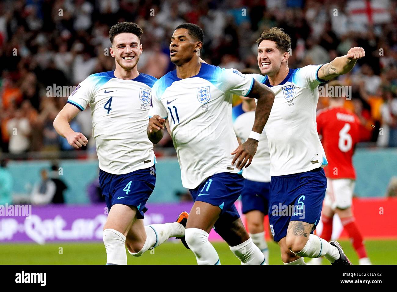 England's Marcus Rashford (centre) celebrates scoring the opening goal ...
