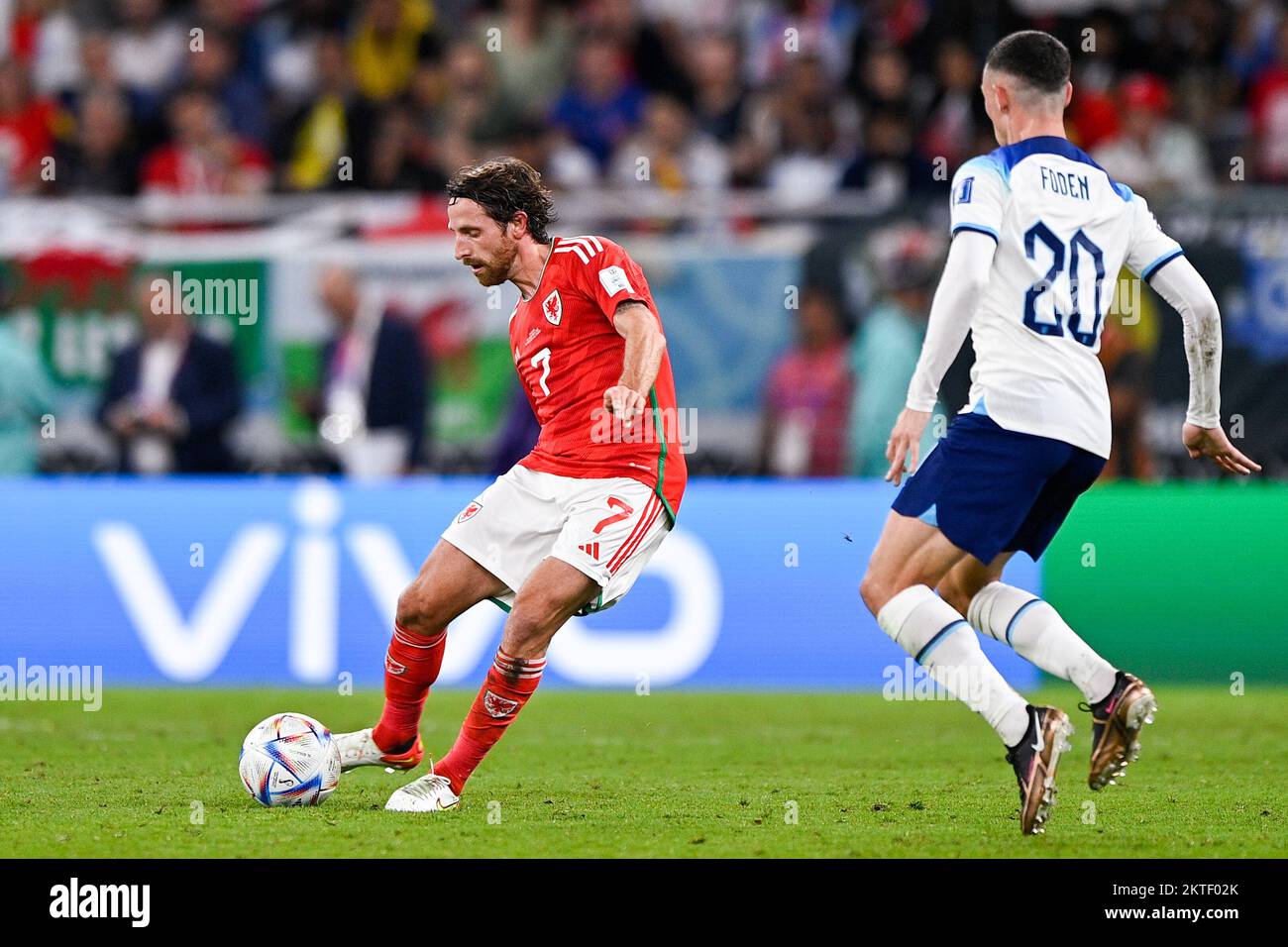 DOHA, QATAR - NOVEMBER 29: Joe Allen of Wales and Phil Foden of England ...