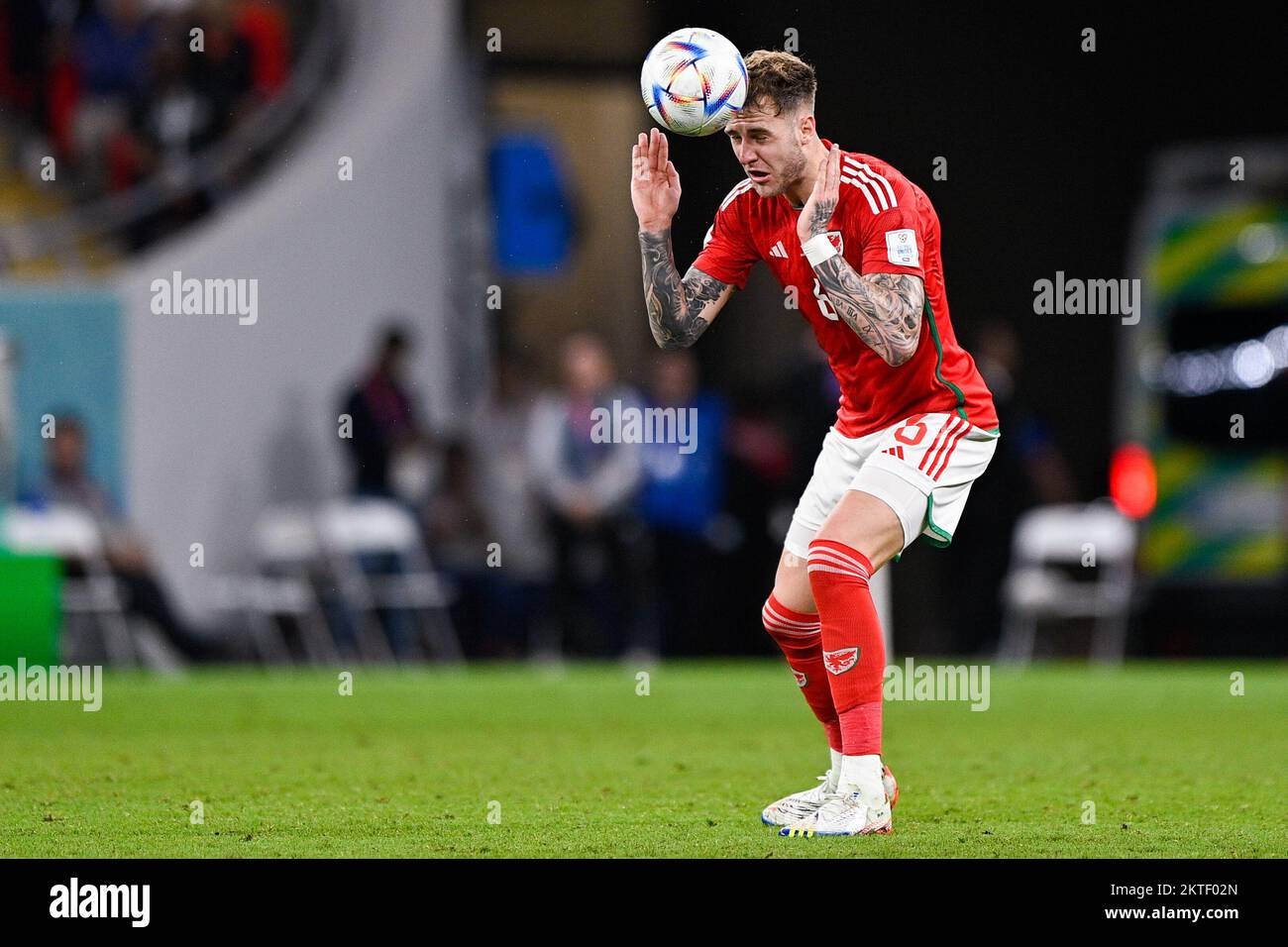 DOHA, QATAR - NOVEMBER 29: Joe Rodon of Wales wins a defensive header ...