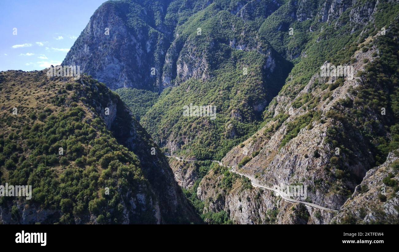 drone shot of rocky mountains and road. Italian Dolomite Mountains ...
