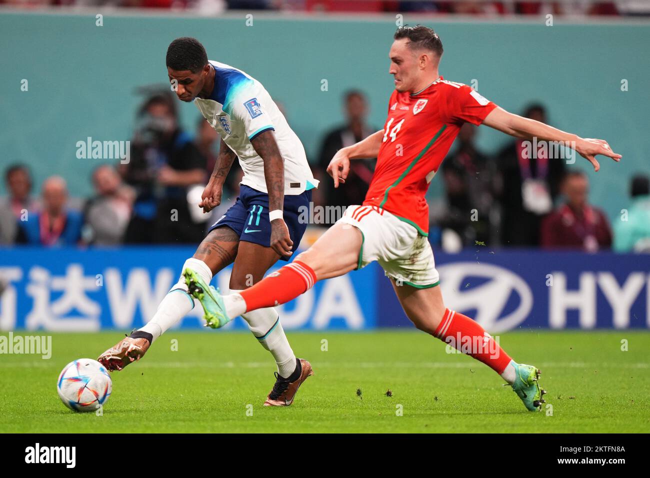 Marcus Rashford of England and Connor Roberts of Wales during the FIFA ...
