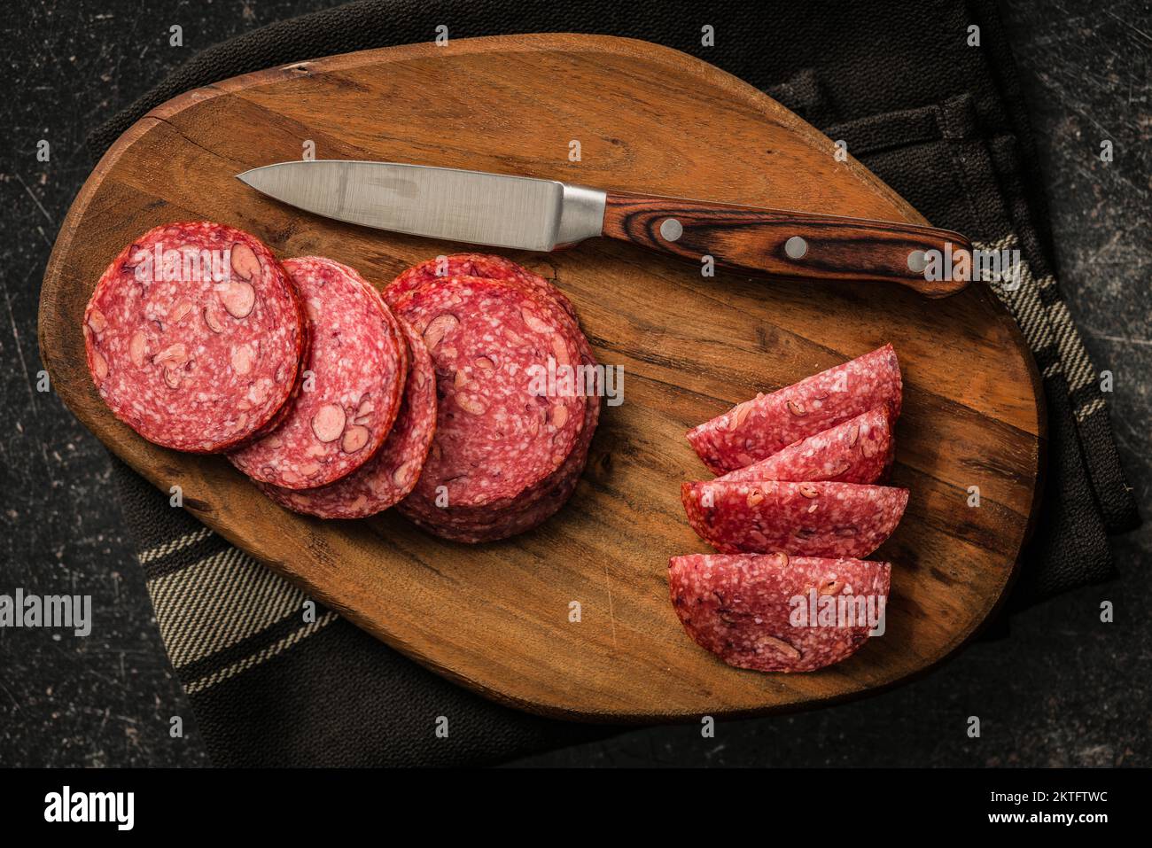 Sliced mexican salami with beans on the cutting board. Top view Stock ...