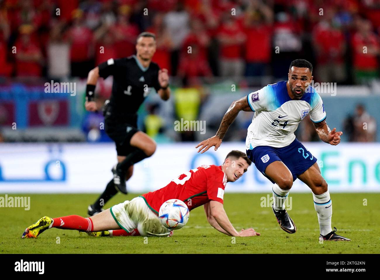 England's Callum Wilson, (right) battles for possession of the ball ...