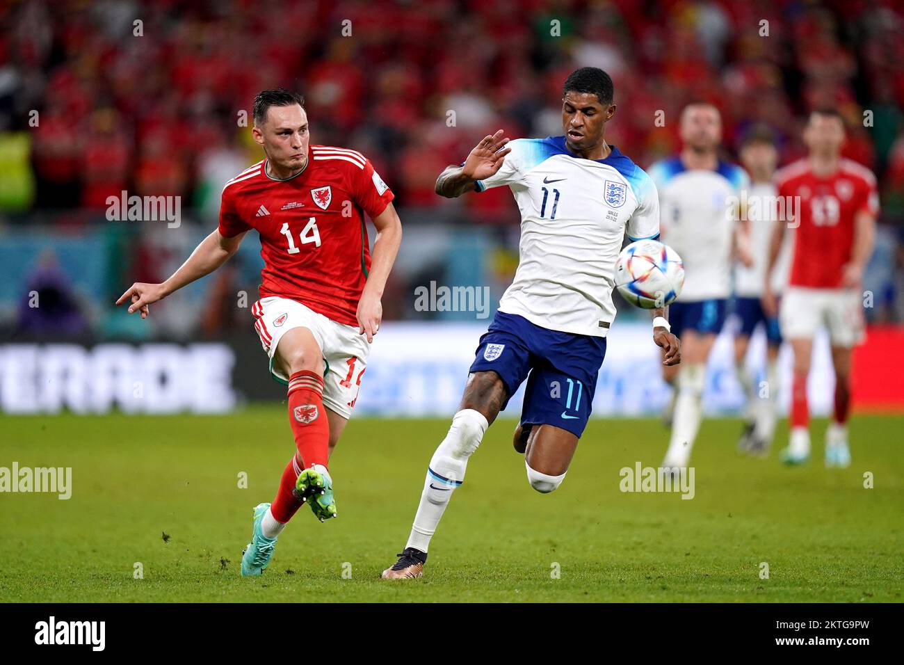 Wales' Connor Roberts, (left) battles for possession of the ball with ...