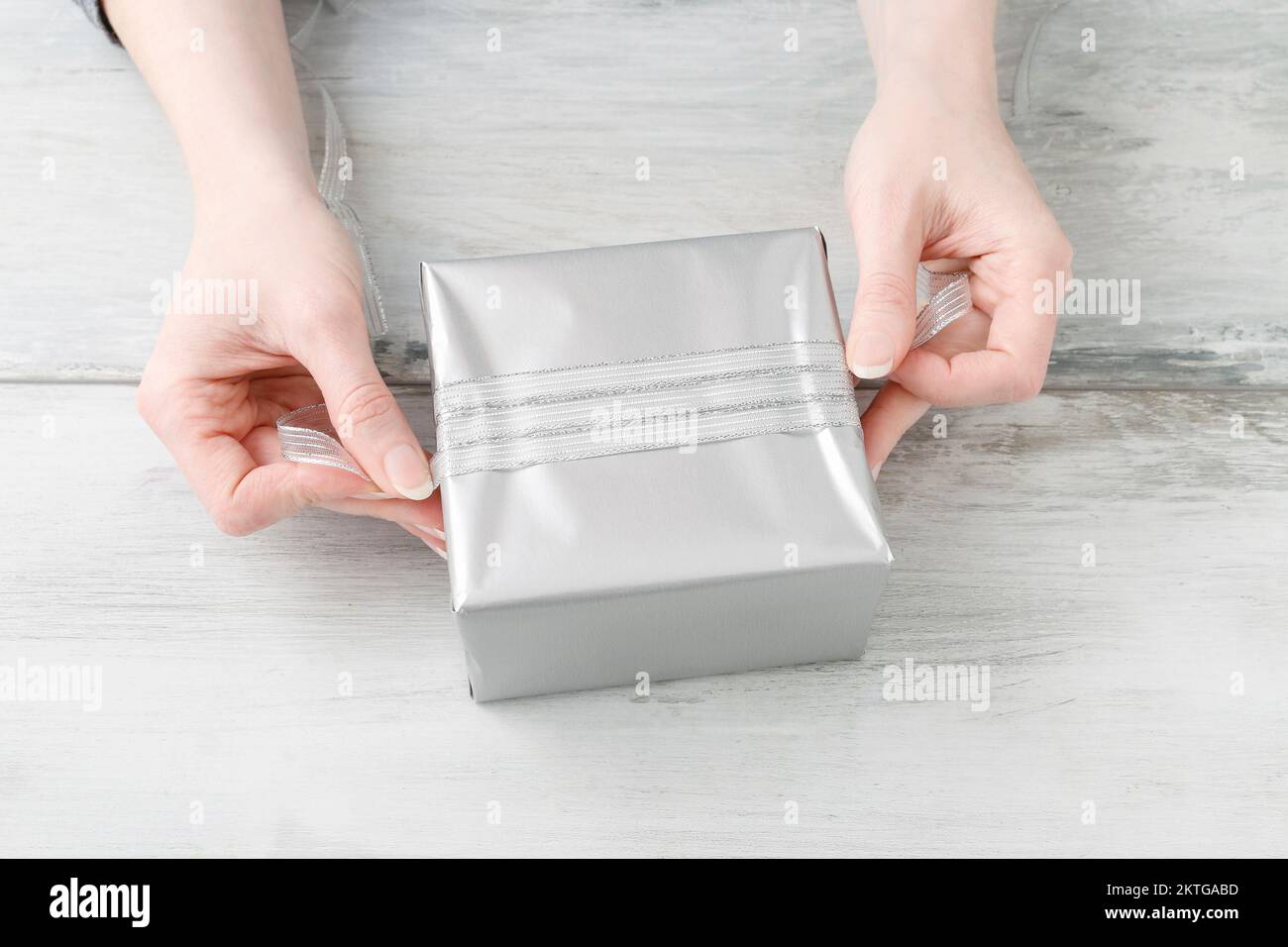 How to wrap and decorate christmas gift. Step by step, tutorial Stock ...