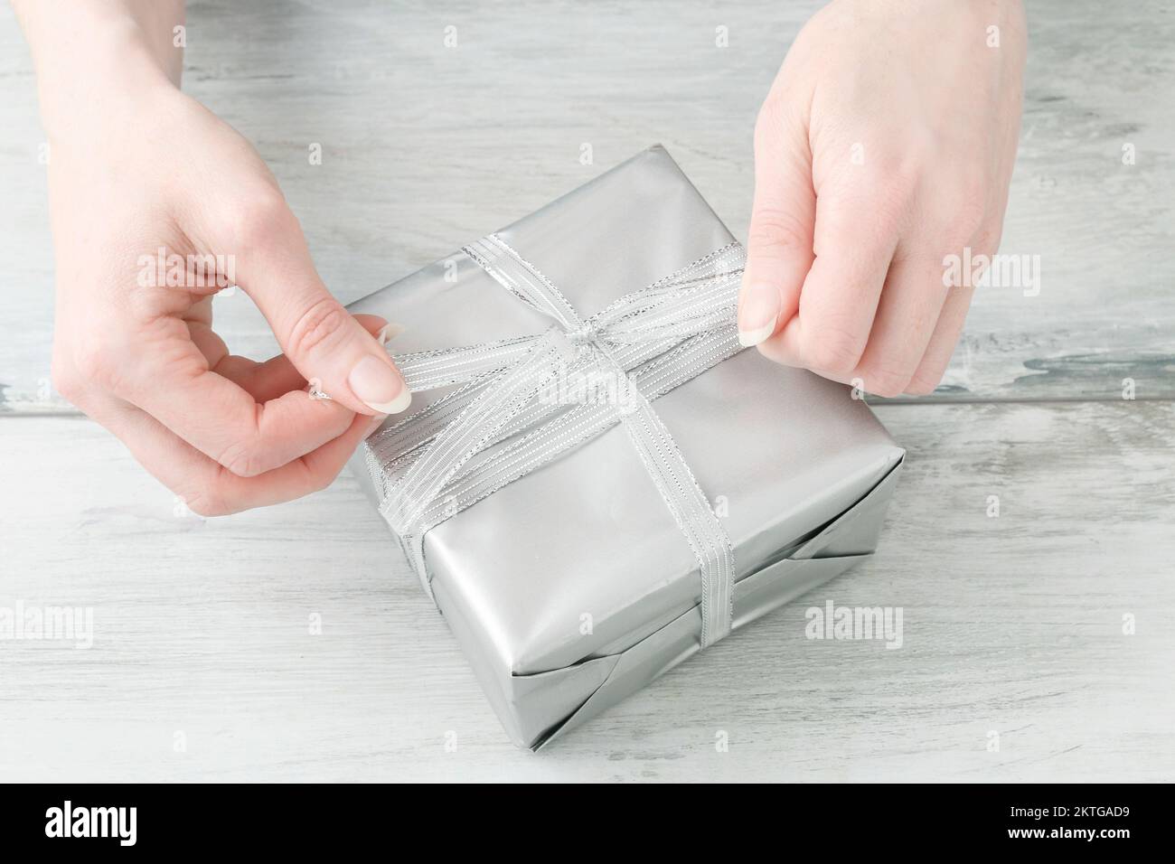 How to wrap and decorate christmas gift. Step by step, tutorial Stock ...