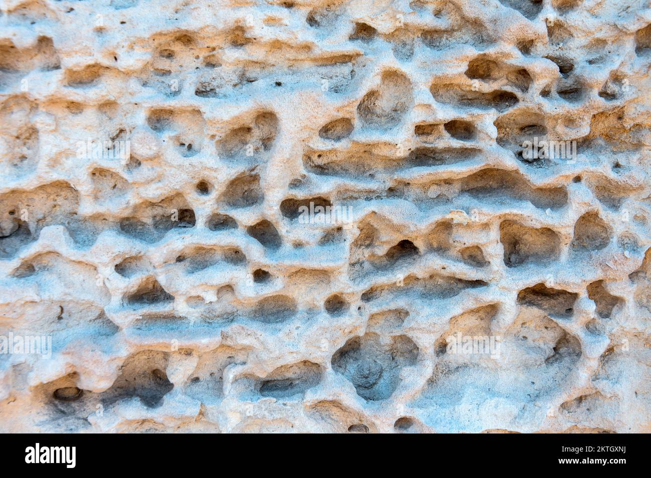 Dimple holes in the ground sand cut Stock Photo - Alamy