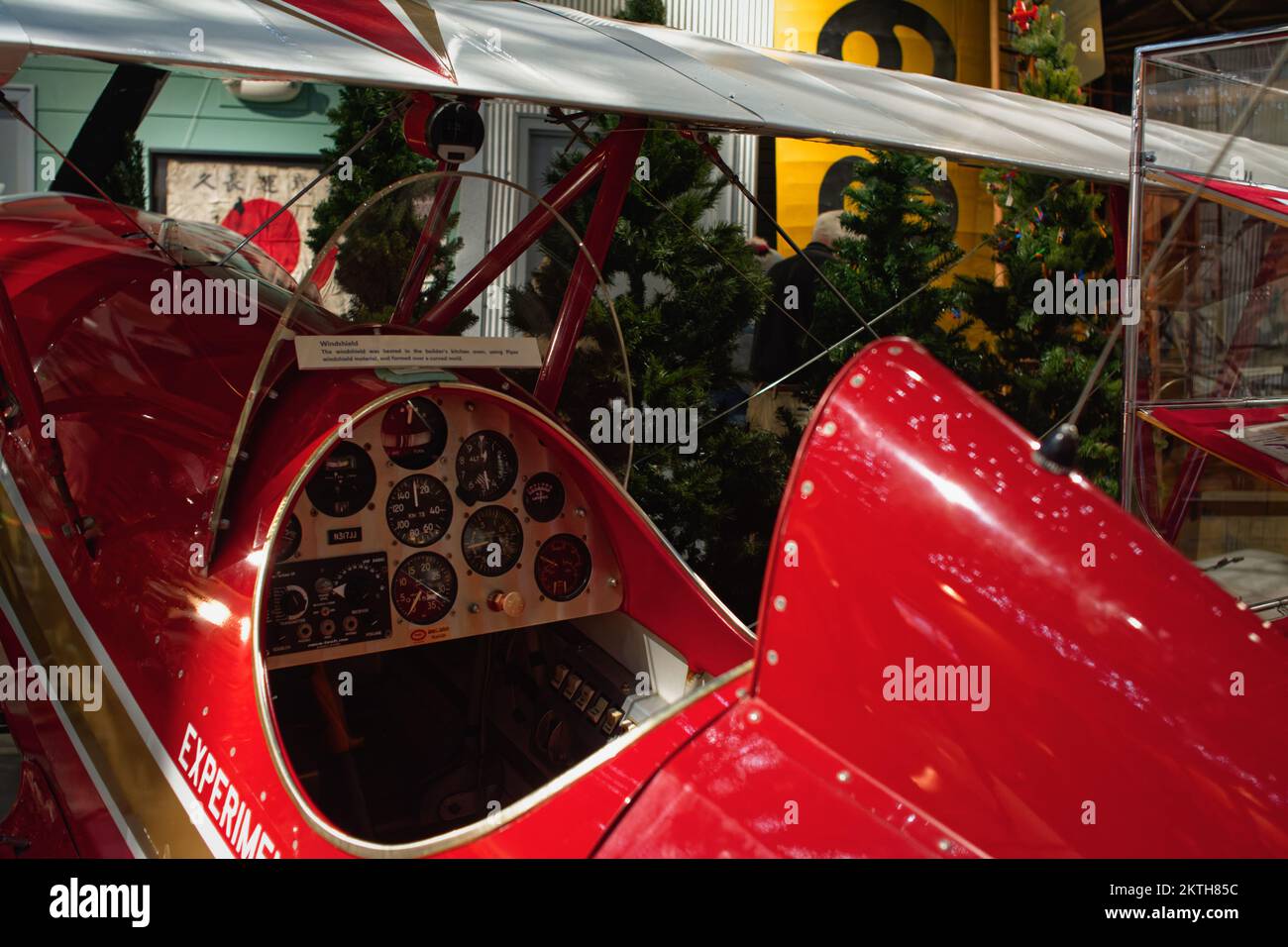 The cockpit of a bright red vintage biplane at the Aviation Museum of ...
