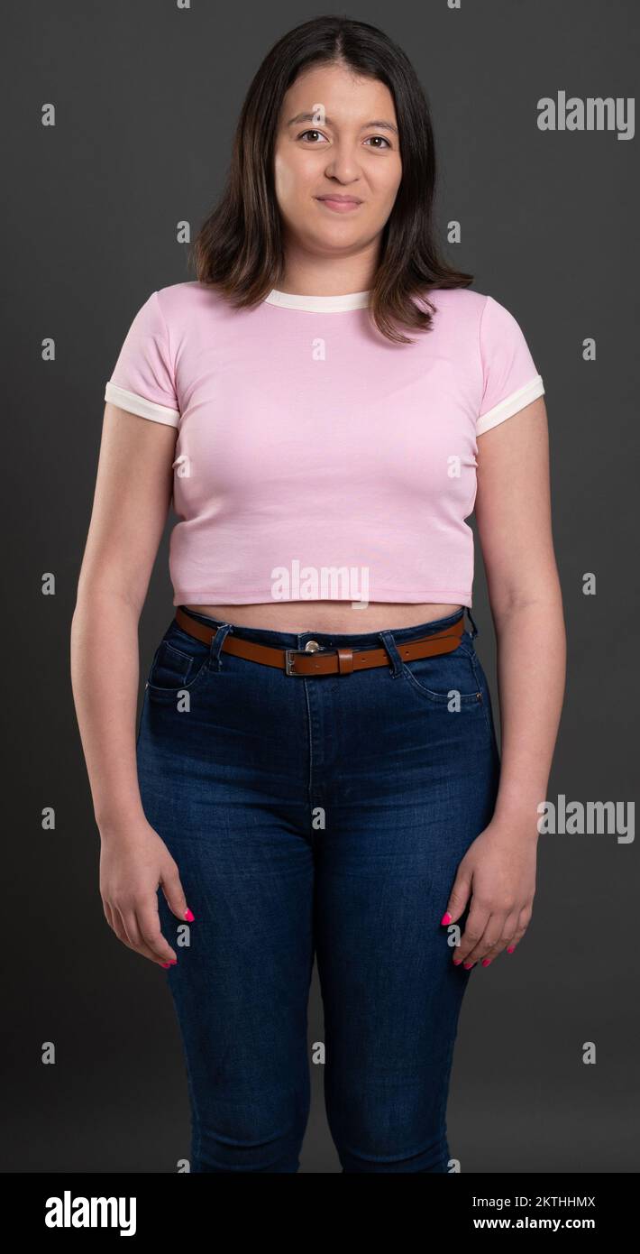 Portrait of plus size model hispanic isolated on grey studio background ...