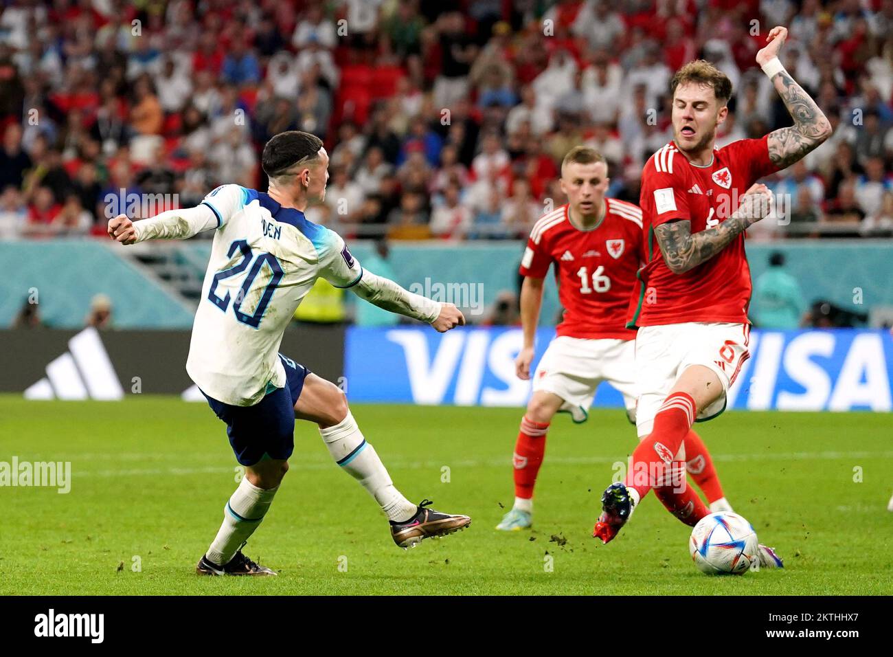 England's Phil Foden, (left) has a shot on goal as Wales' Joe Rodon ...
