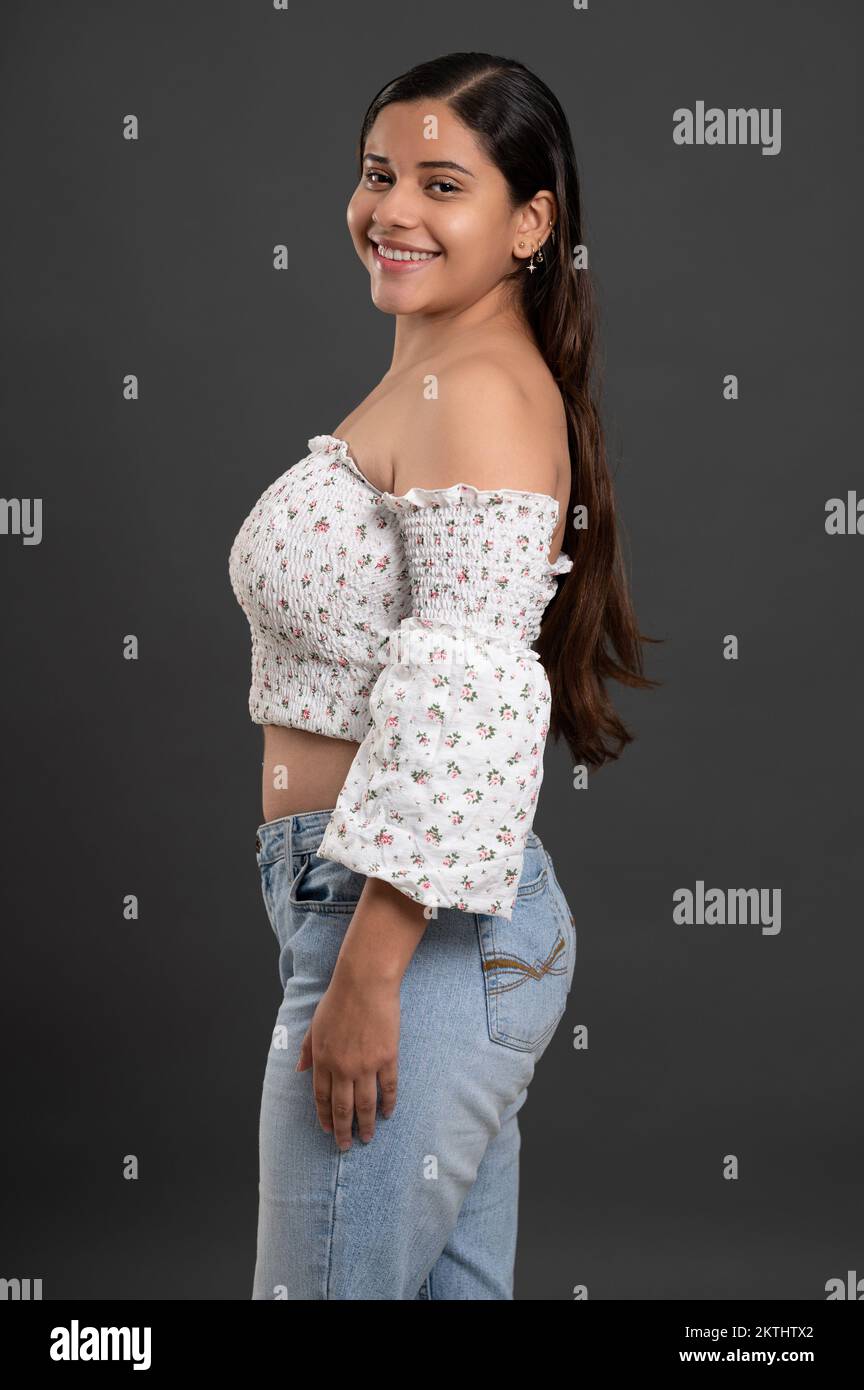 Portrait of hispanic smiling young woman side profile view isolated on ...