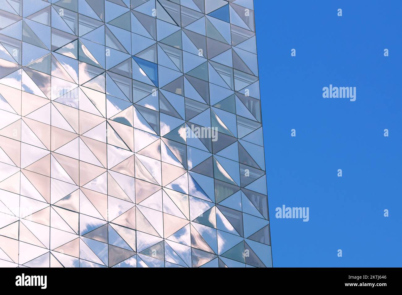 Low angle view of modern building against clear blue sky Stock Photo ...