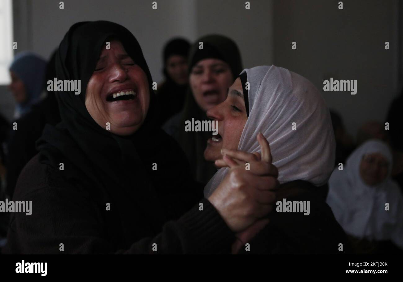 Beit Ummar. 29th Nov, 2022. People mourn during a funeral of a ...
