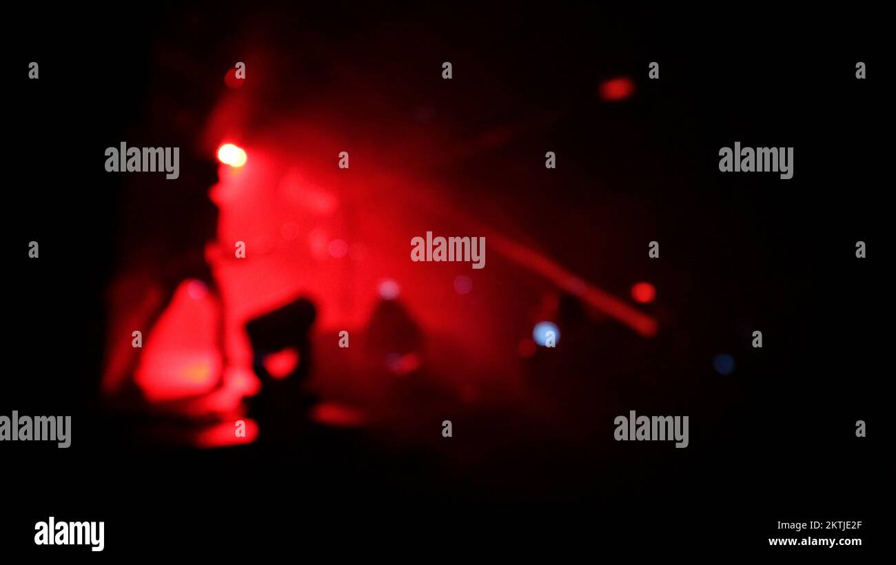 Out of focus picture of people at music concert indoors Stock Photo - Alamy