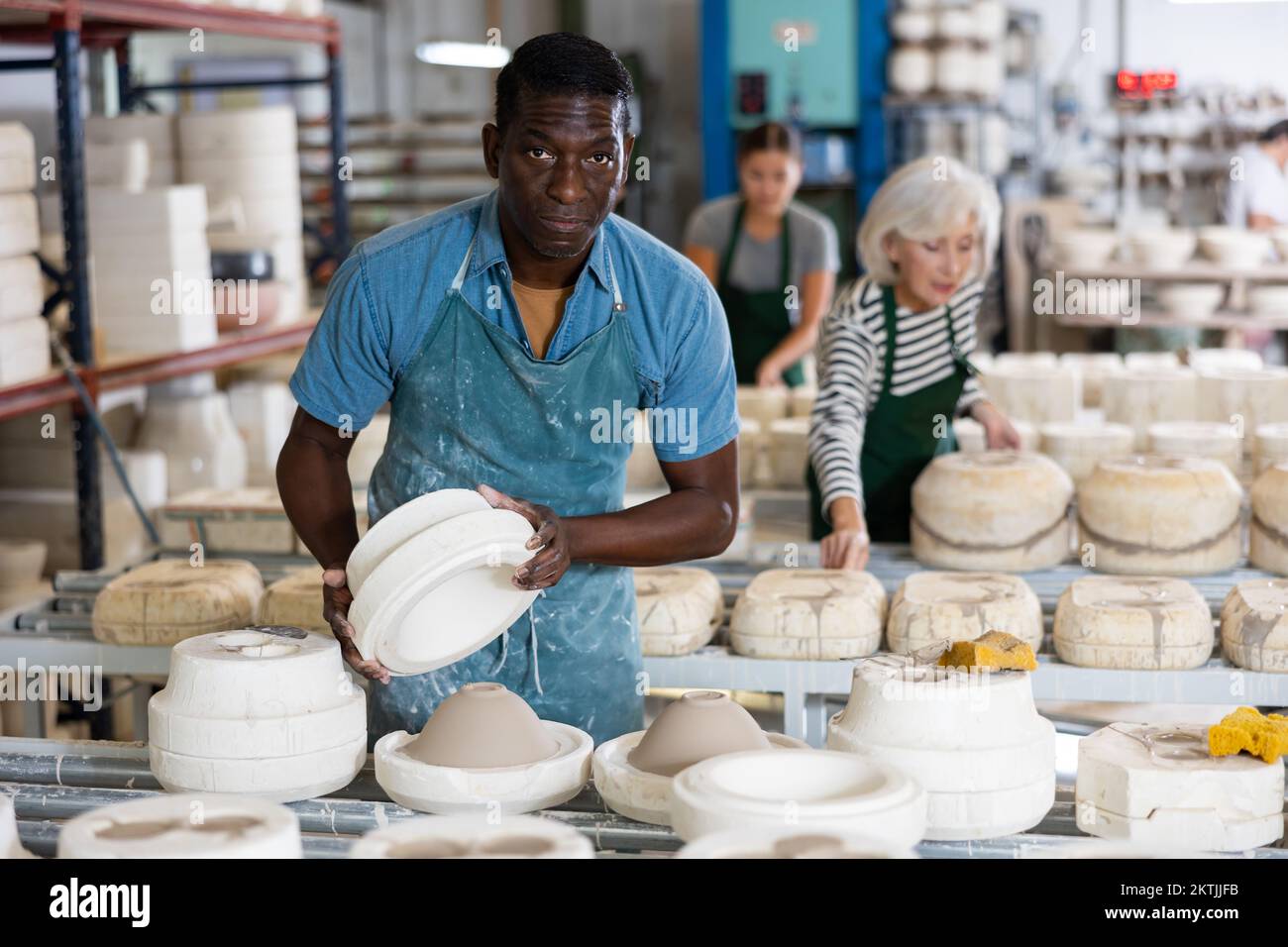 Ceramist making clay product in hi-res stock photography and images - Alamy