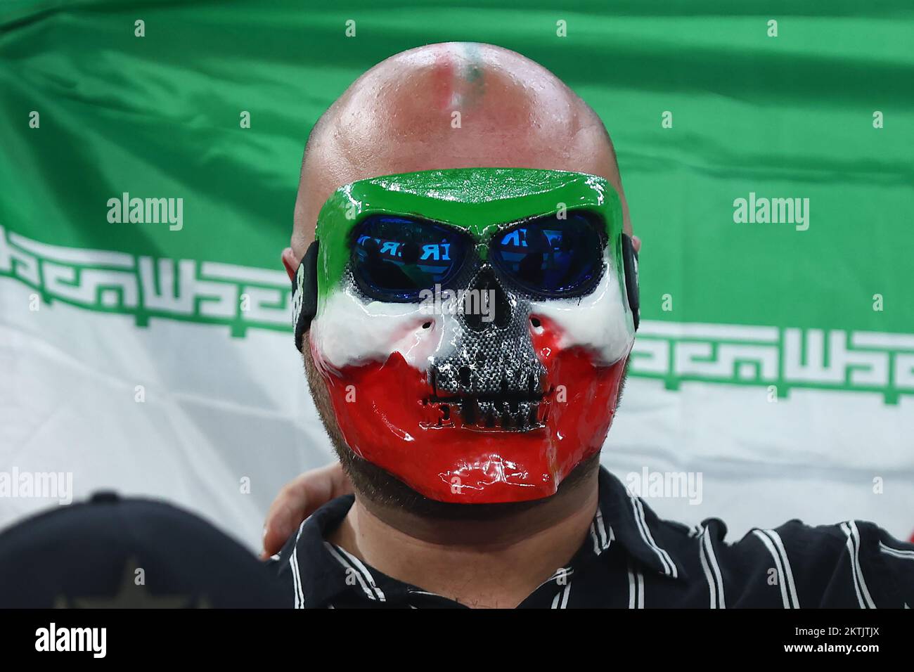 Doha, Qatar. 29th Nov, 2022. An IR Iran fan looks on during the 2022 ...