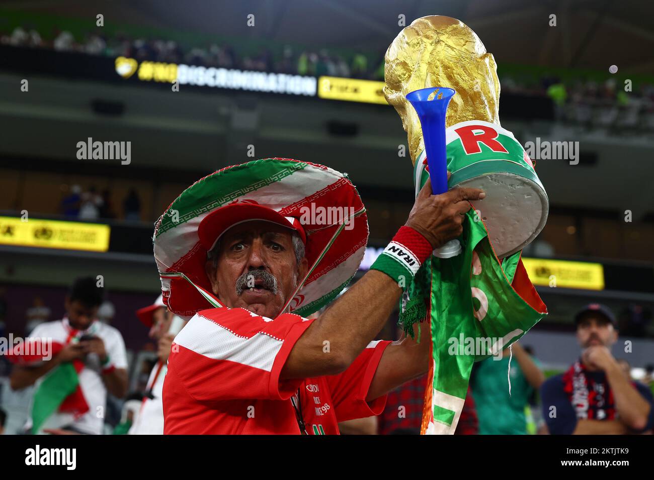 Doha, Qatar. 29th Nov, 2022. An IR Iran fan holds a replica World Cup ...