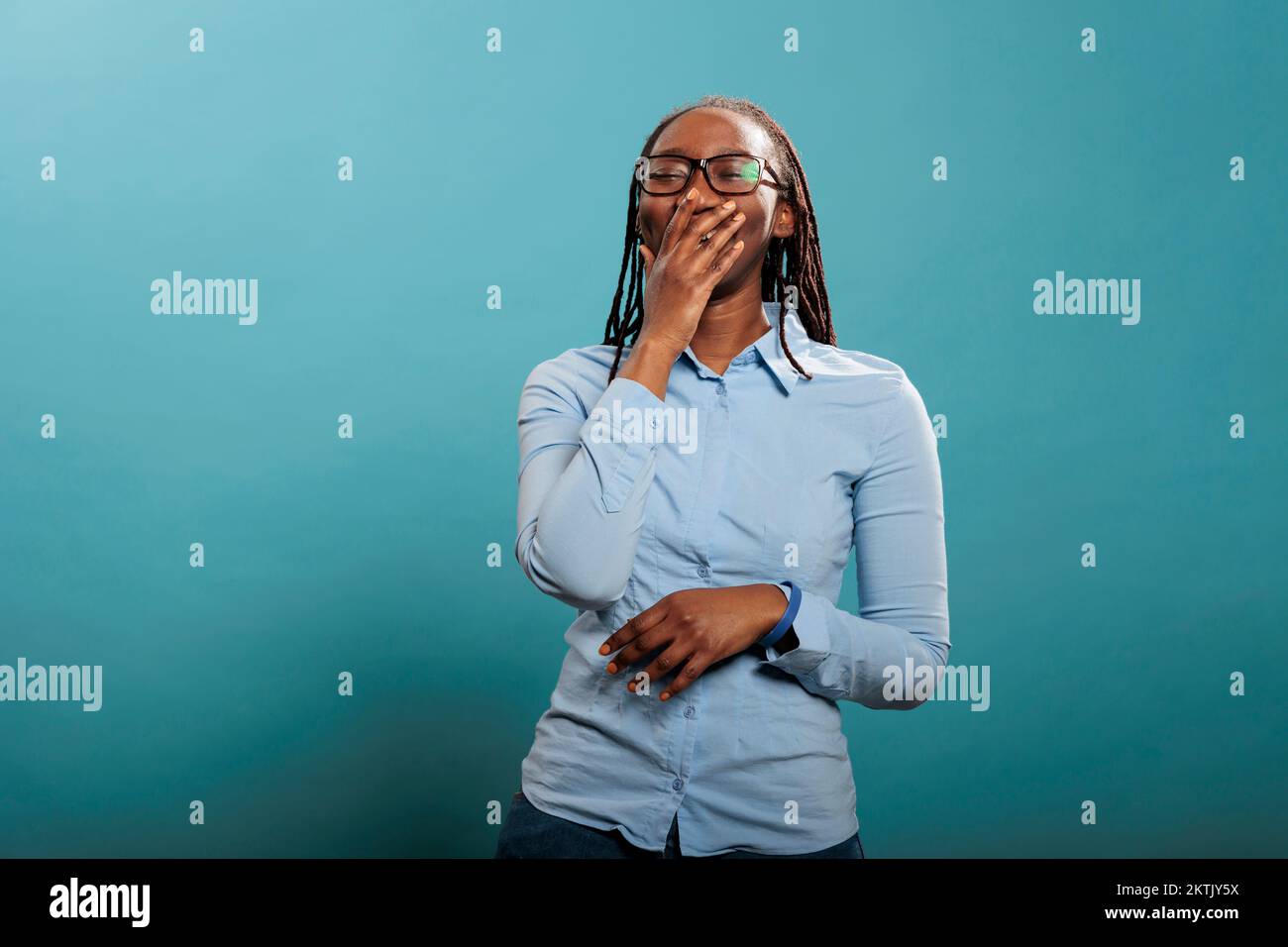 Joyful cheerful woman laughing heartily after heard a funny joke an ...