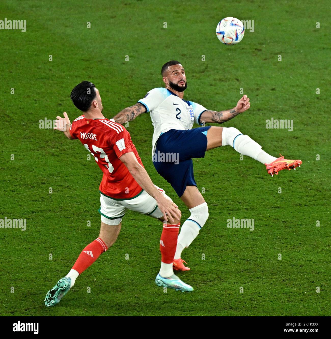 Al Rayyan, Qatar. 29th Nov, 2022. Kyle Walker (R) of England vies with ...