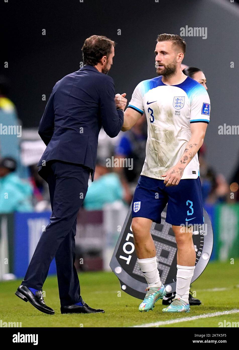England's Luke Shaw with manager Gareth Southgate as he is substituted ...