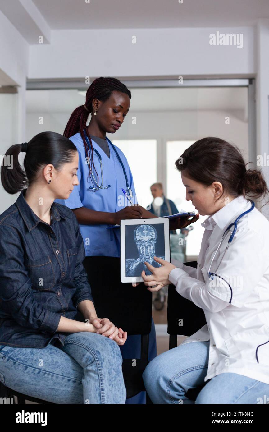 Laboratory doctor examining inside body images of patient in hospital ...