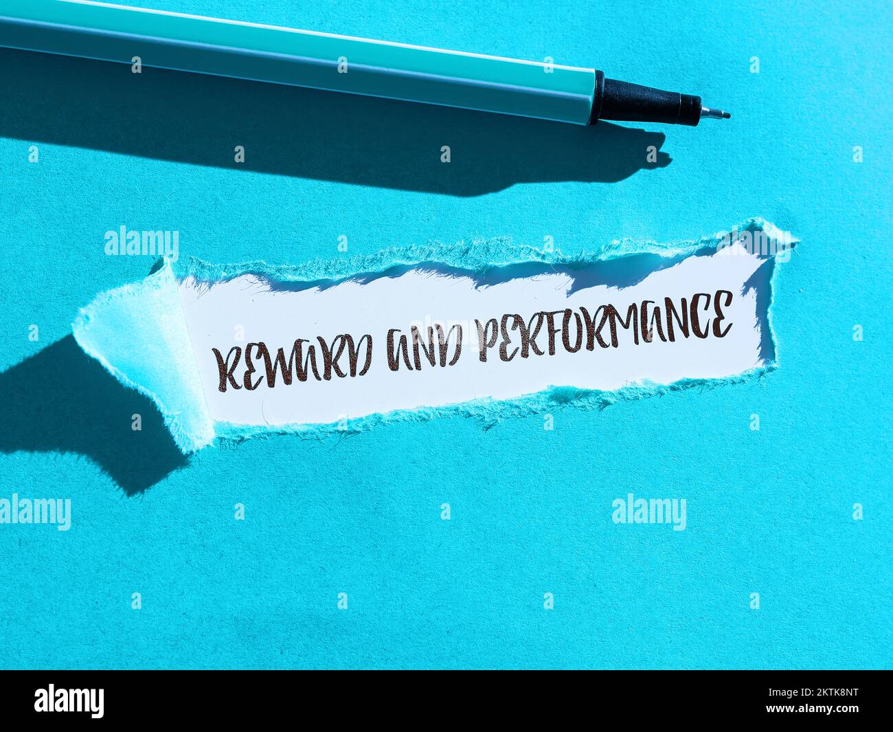 Hand writing sign Reward And Performance, Word Written on Given in ...