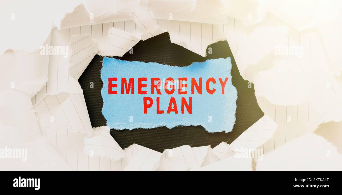 Sign displaying Emergency Plan, Business overview Procedures for ...