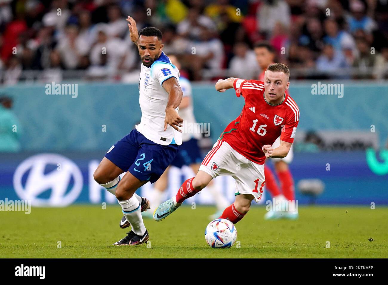 Wales' Joe Morrell, (right) battles for possession of the ball with ...
