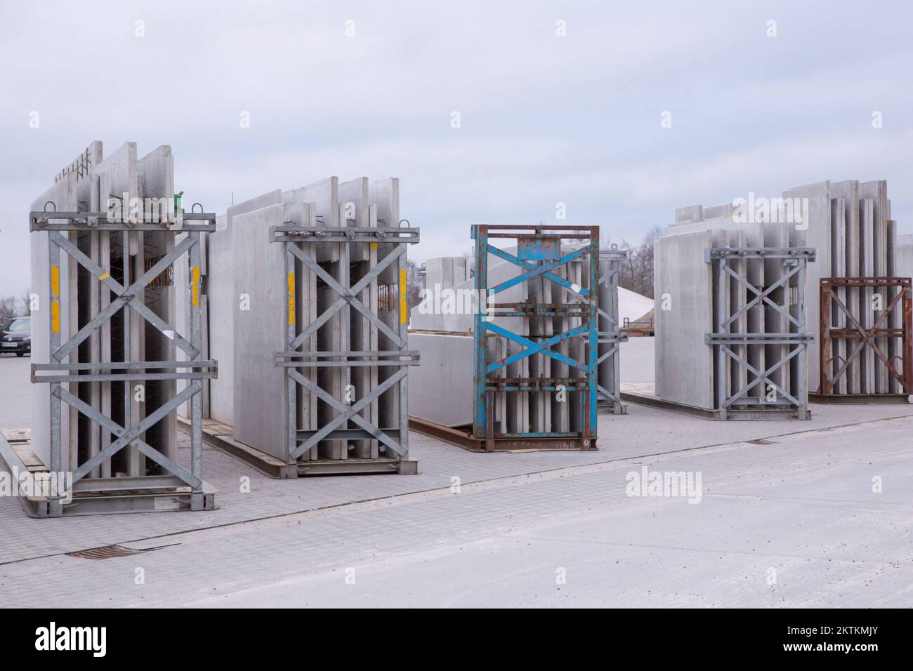 Picture of precast concrete walls ready for shipping in transport racks ...