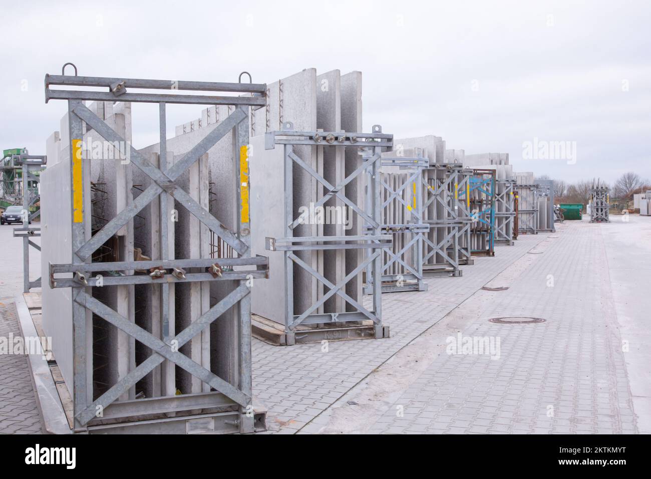 Picture of precast concrete walls ready for shipping in transport racks ...