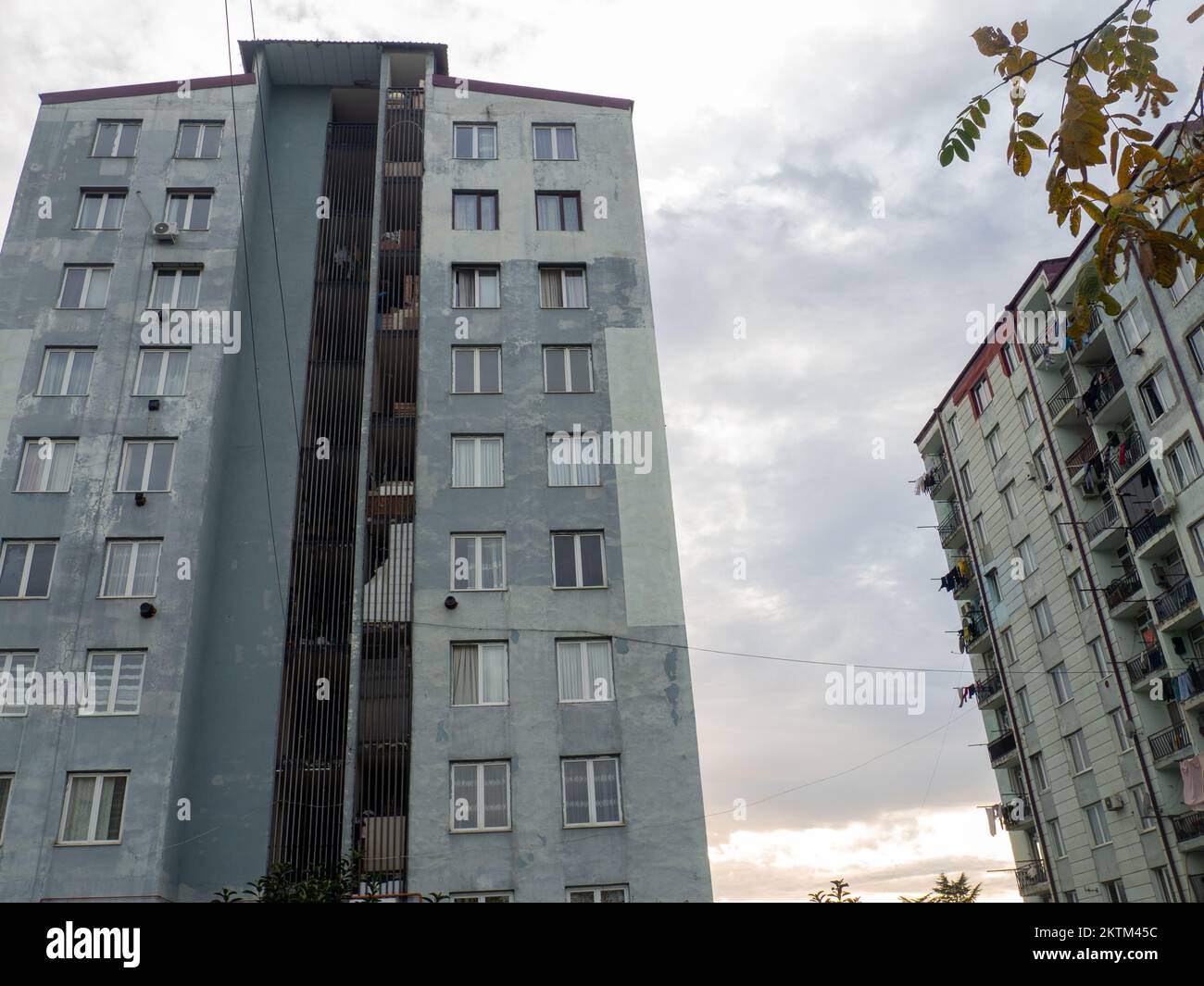 Gray old panel house. Nine-story building. Old architecture. Housing of ...