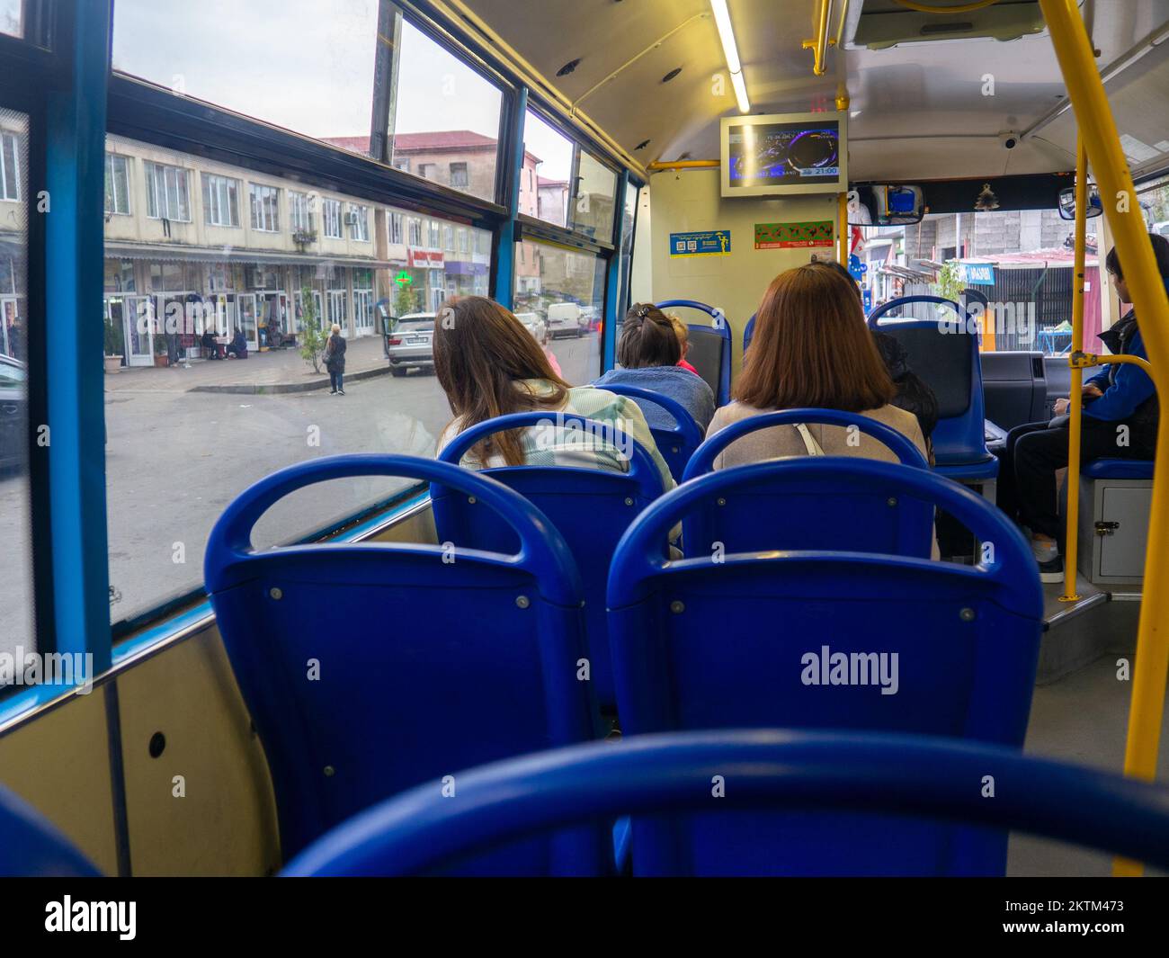 Batumi, Georgia. 11.21.2022 People sitting with their backs in an empty bus. The concept of ...