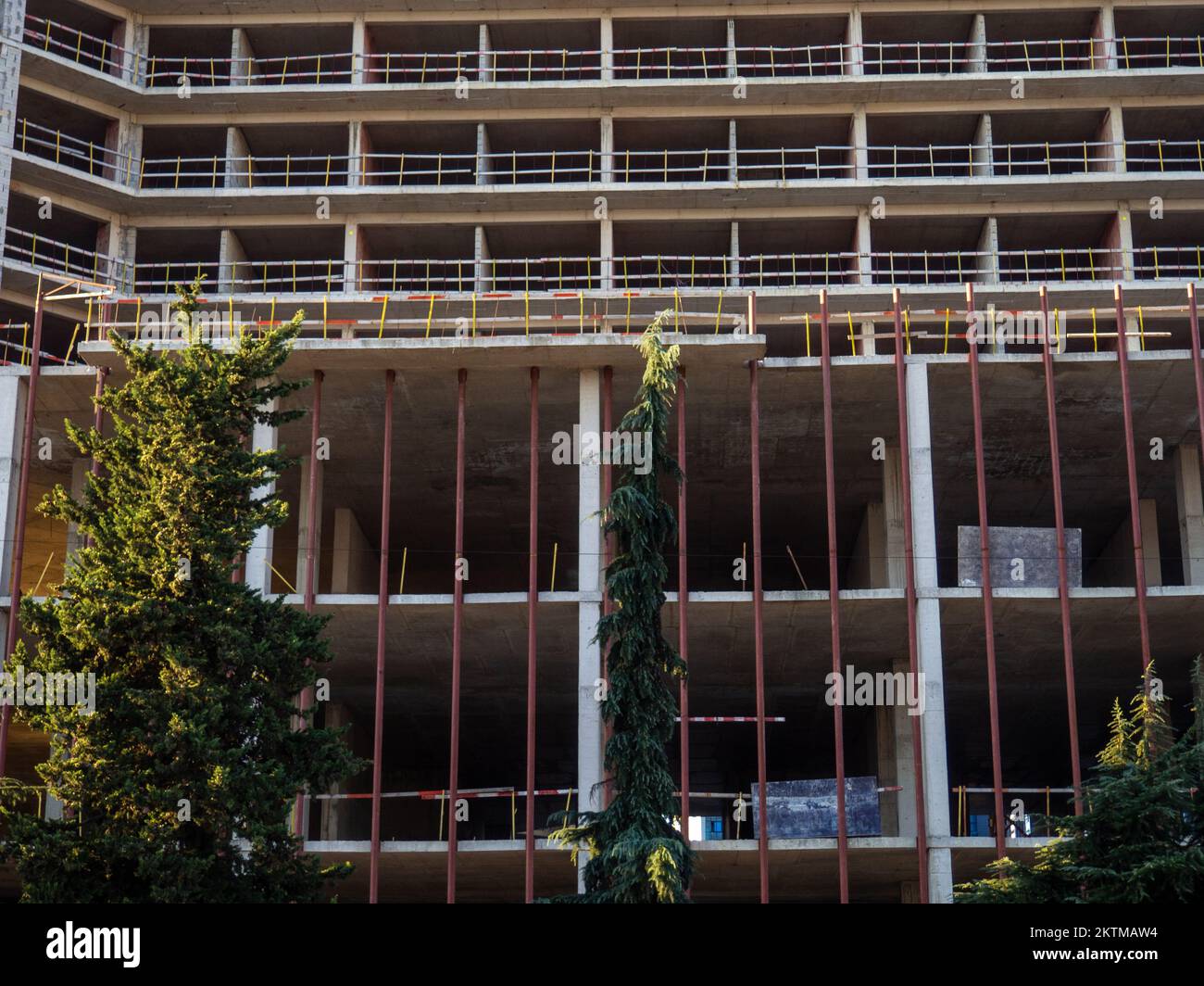 Construction of a modern high house. Building frame. Gray concrete ...