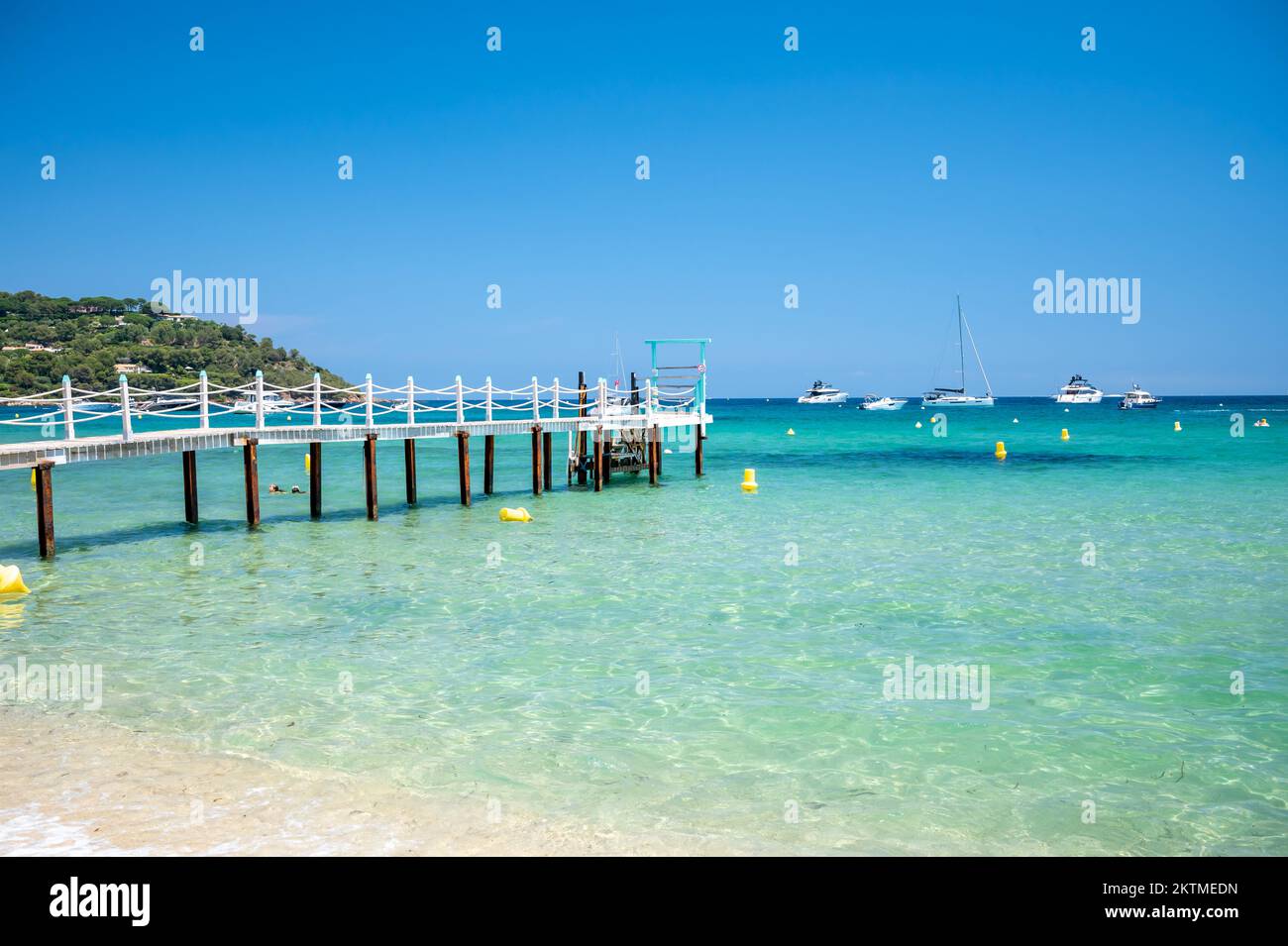 Wooden pier for guests of yachts on legendary Pampelonne beach near ...